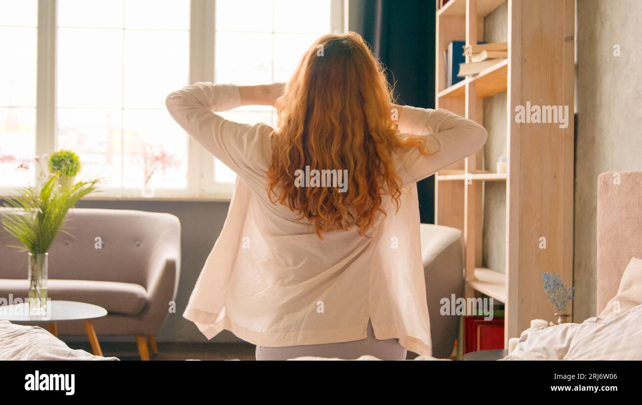 Sunny morning at home bedroom girl wake up at hotel woman waking up ...