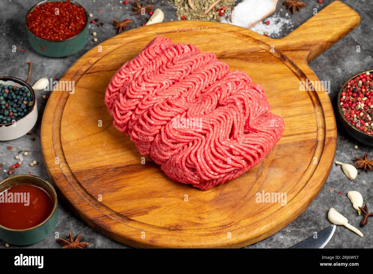 Ground beef. Fresh raw beef minced meat on dark background. Butcher ...