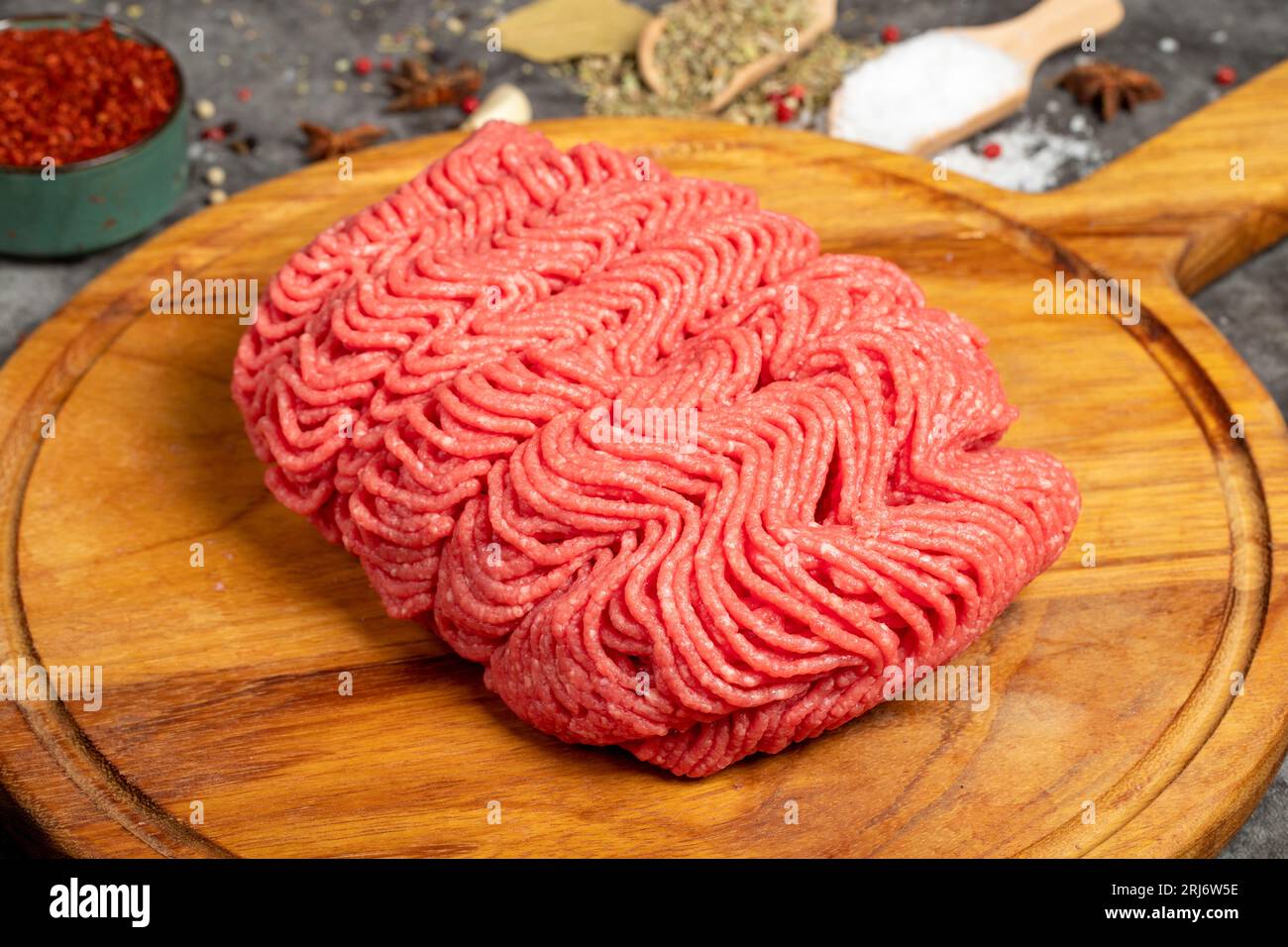 Ground beef. Fresh raw beef minced meat on dark background. Butcher ...