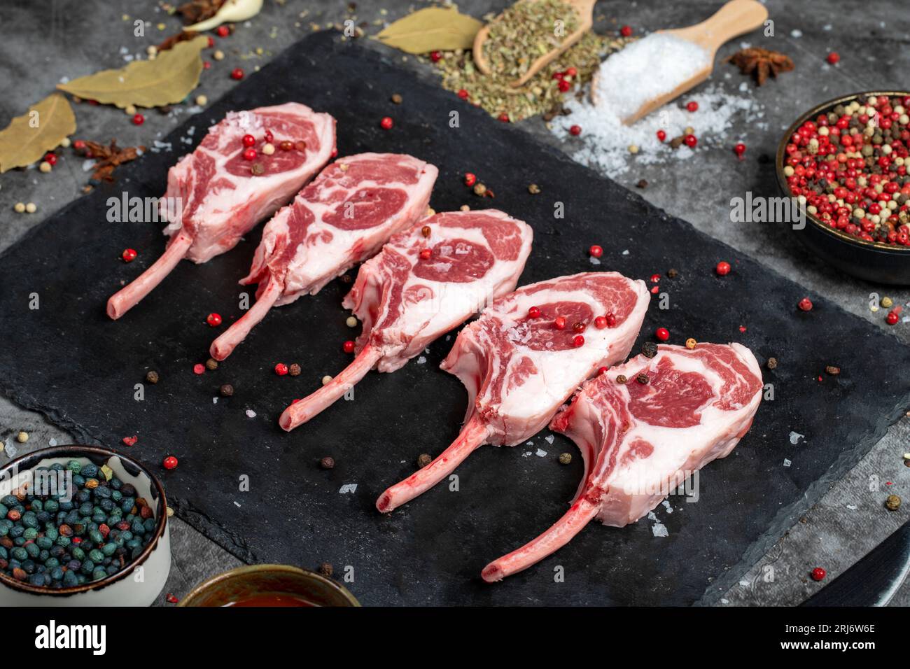 Lamb chops. Fresh raw lamb chops on dark background. Butcher products ...