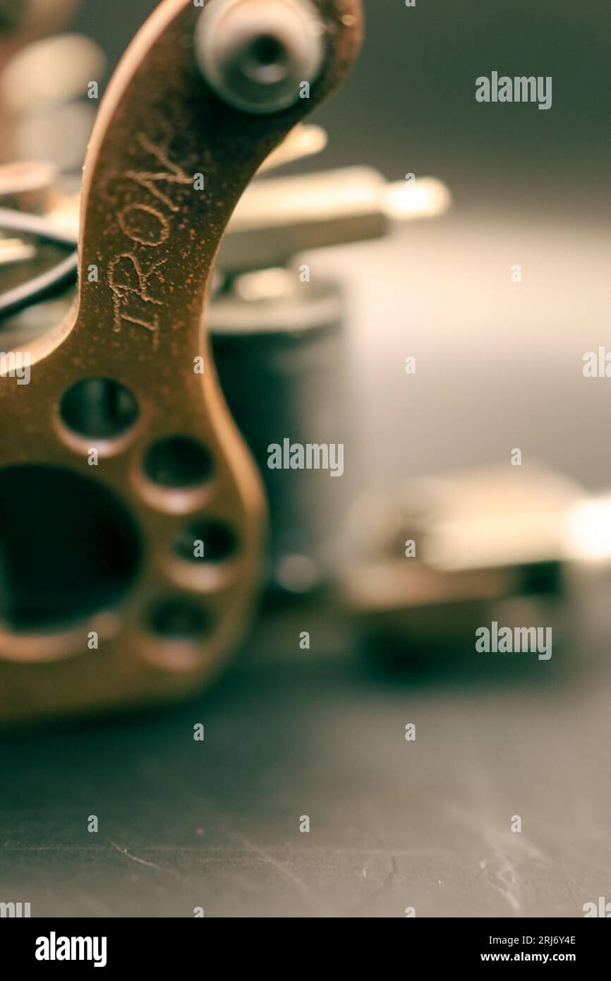 Close ups of an old school coil tattoo machine Stock Photo - Alamy