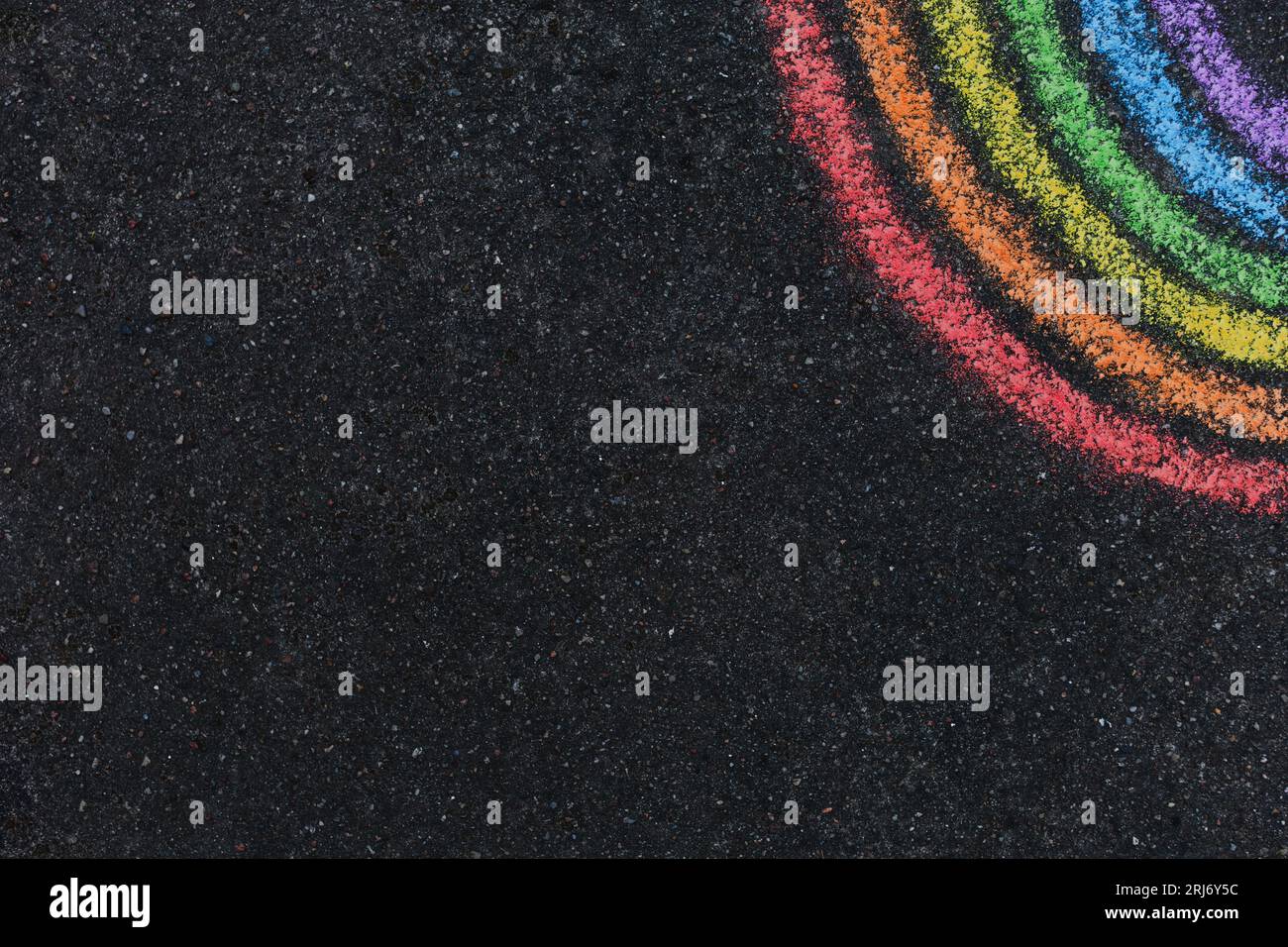 A colorful rainbow painted on a road with chalk, shot from above Stock ...