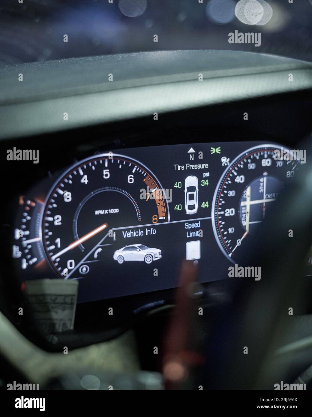 A vertical shot of the dashboard cluster of a car, showing the various ...