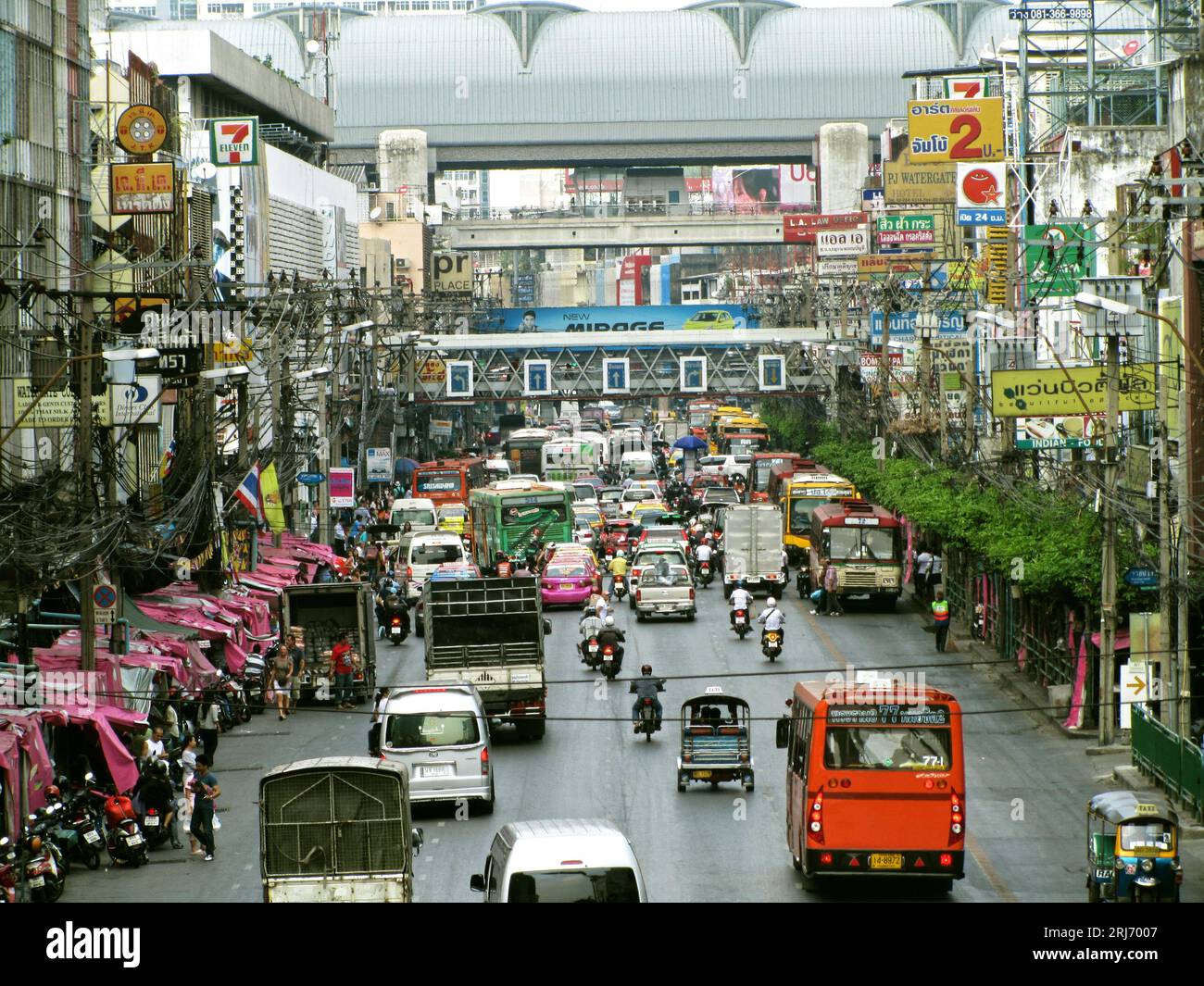 A bustling street scene in Bangkok, Thailand, with a multitude of ...