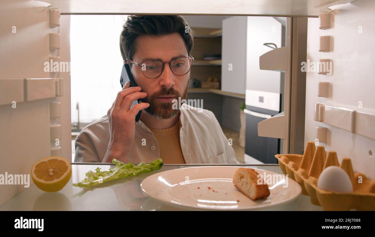 Point of view POV inside refrigerator Caucasian male man guy open ...