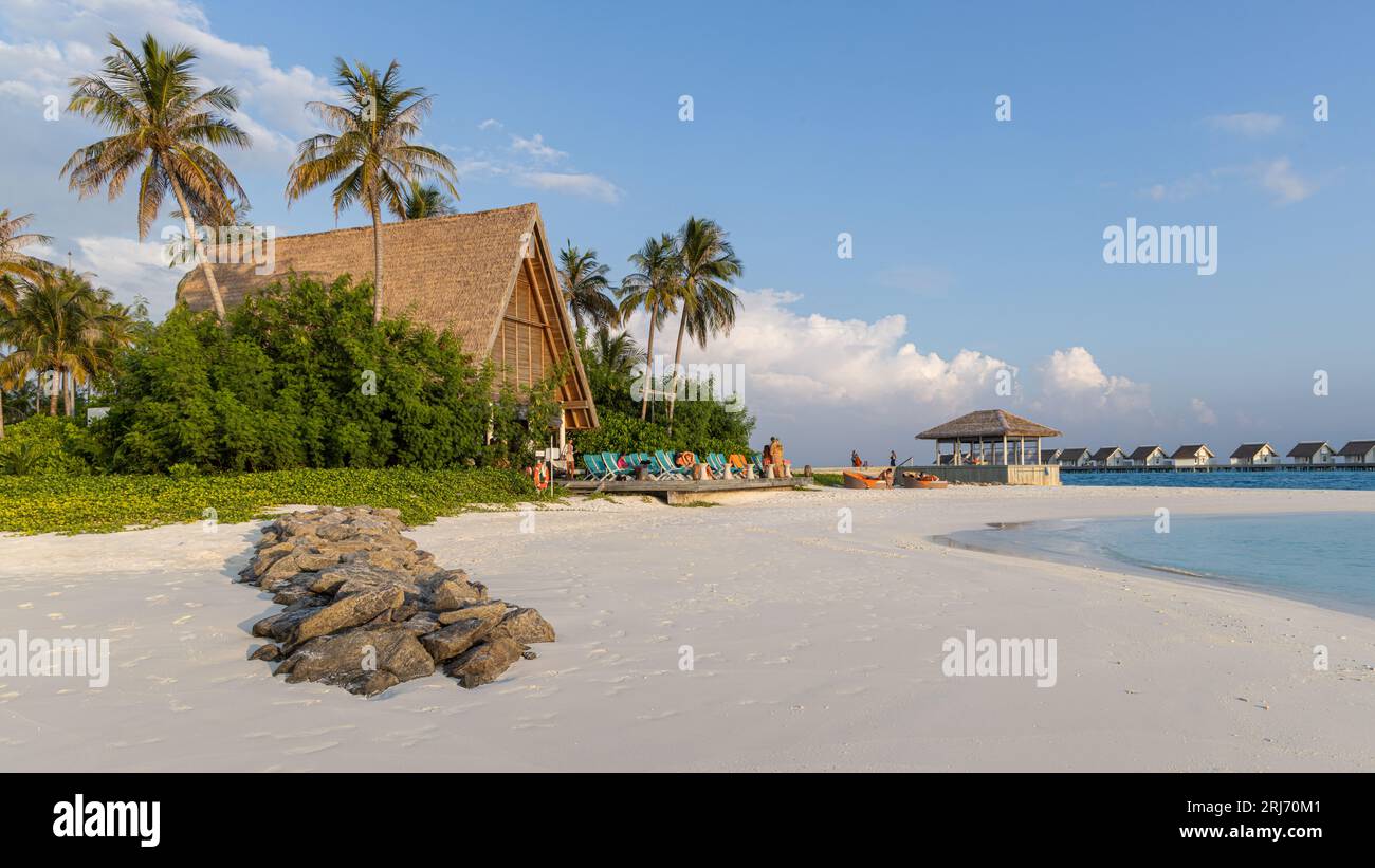 A stunning aerial view of a beach resort with pristine white sand and ...