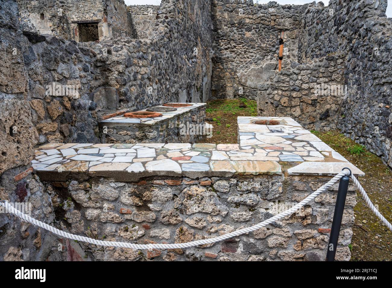 Shop counter from one of the many shops on Via Stabiana in the ruins of ...