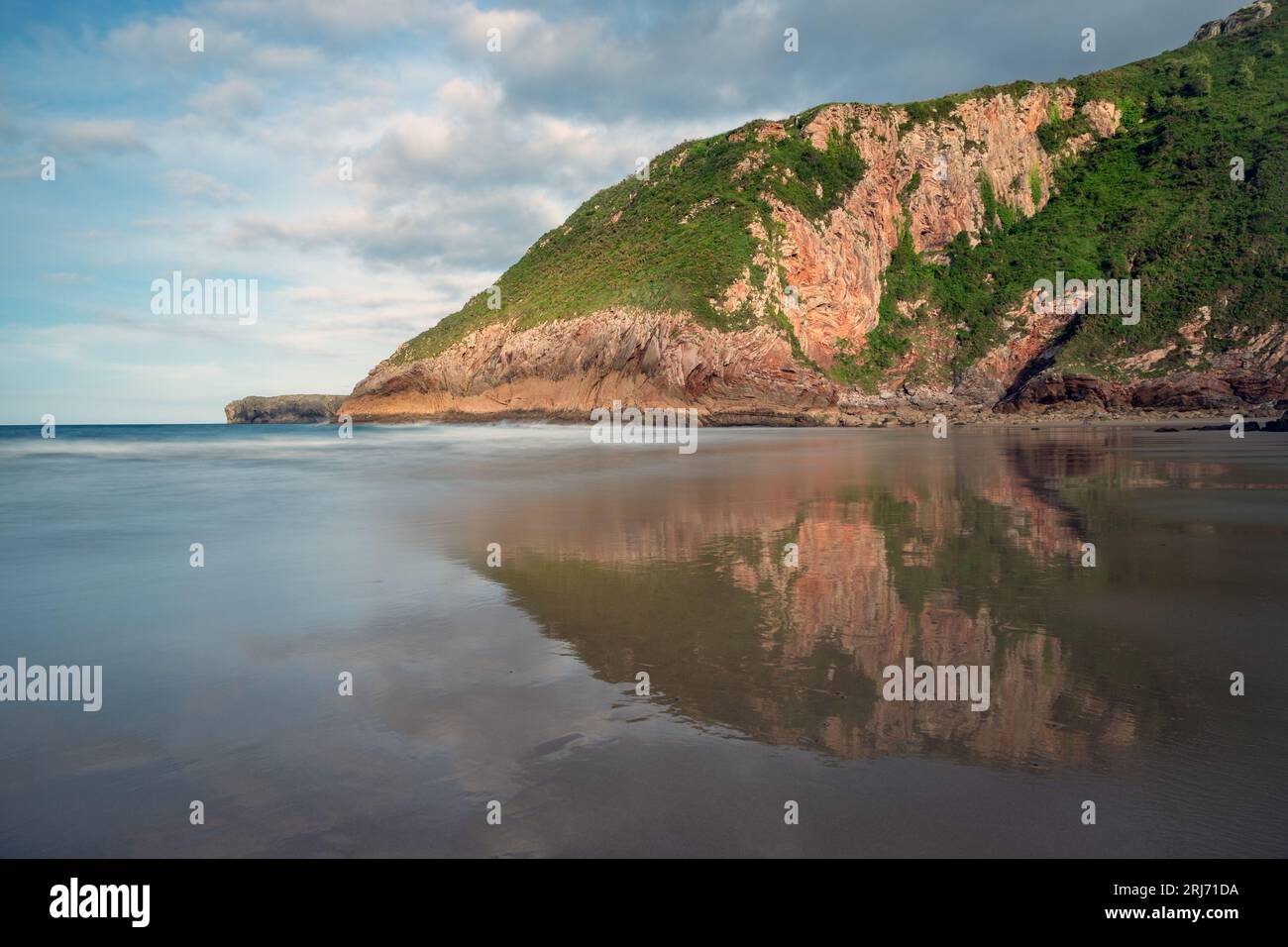 Ballota beach in llanes with its famous rock formation at sunset ...