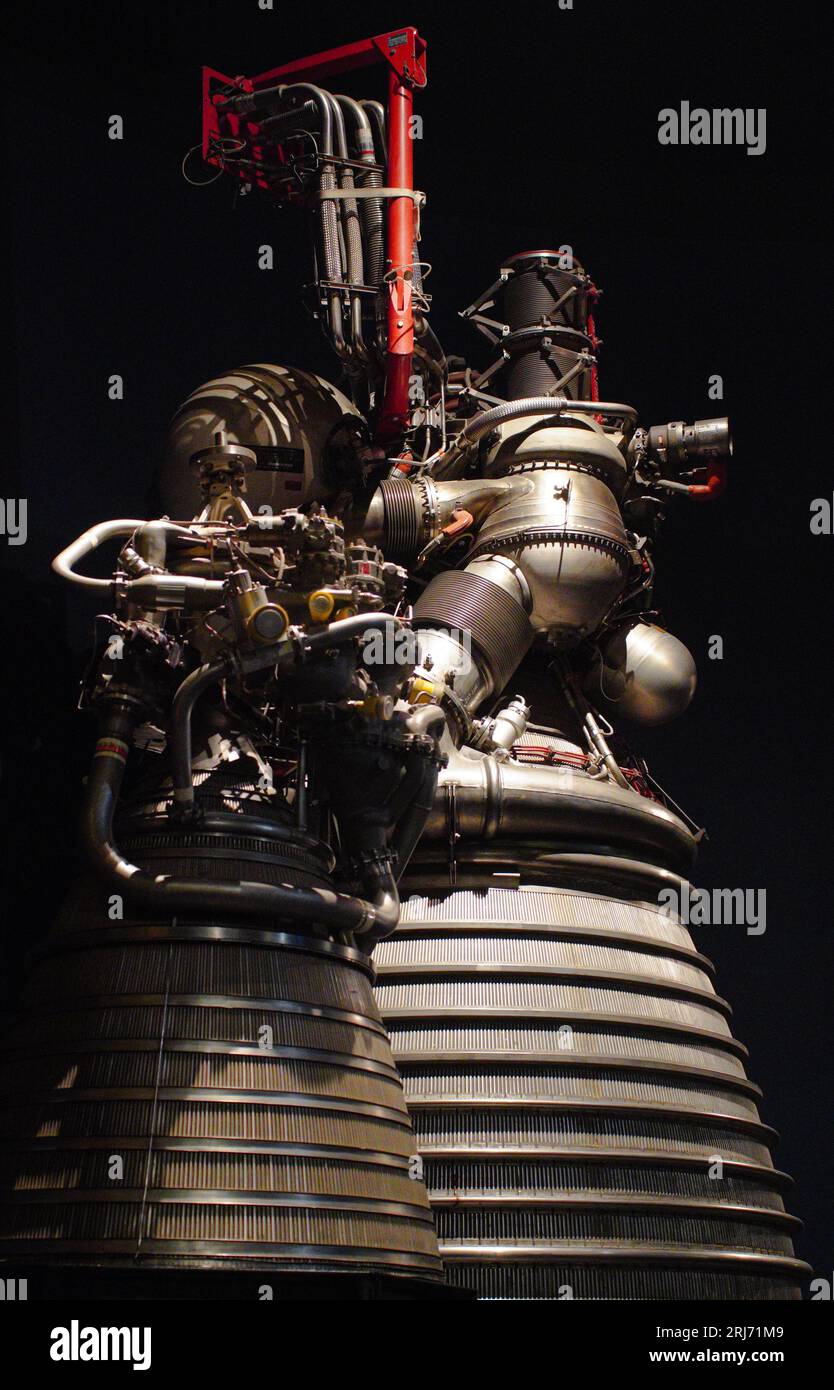 An isolated image of a small engine mounted on the top of a large ...