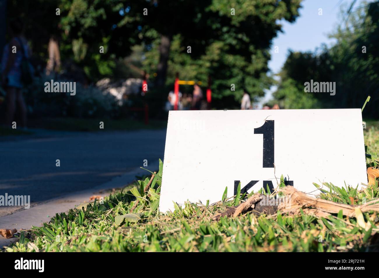 A sign indicating a kilometer in a race Stock Photo - Alamy