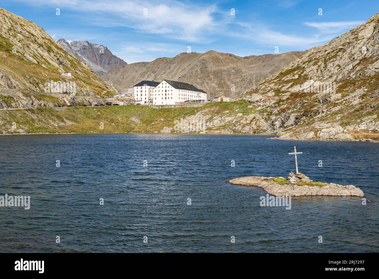 An alpine landscape with lush fields and rolling hills at the Col du ...