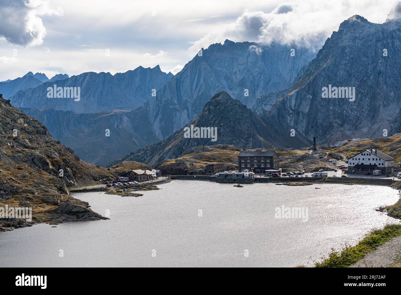 An alpine landscape with lush fields and rolling hills at the Col du ...