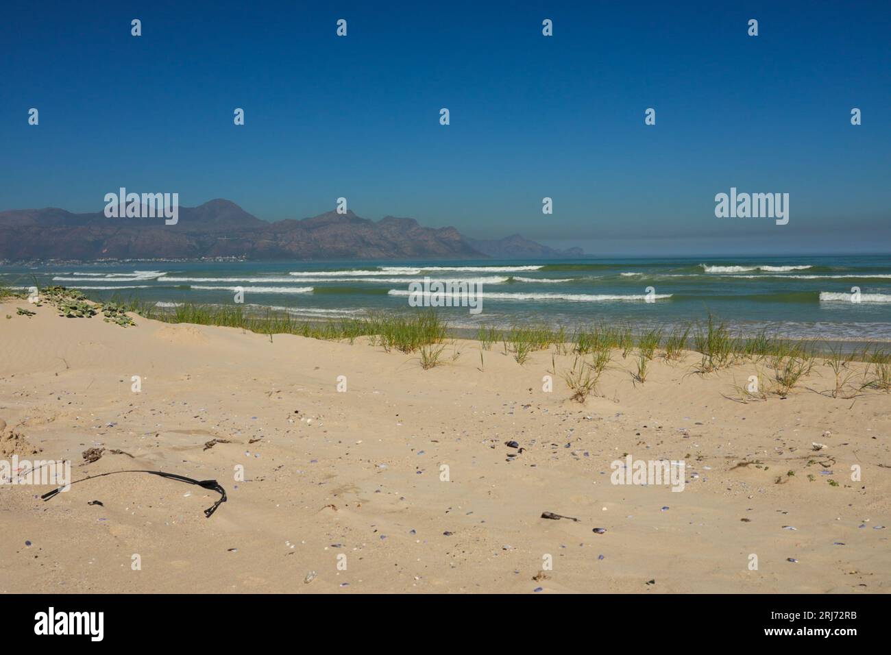 Beautiful view of the Helderberg mountain range from Strand beach Stock ...