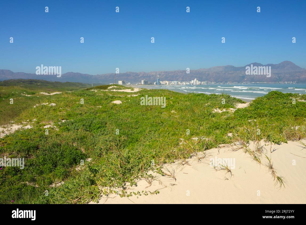 Beautiful view of the Helderberg mountain range from Strand beach Stock ...