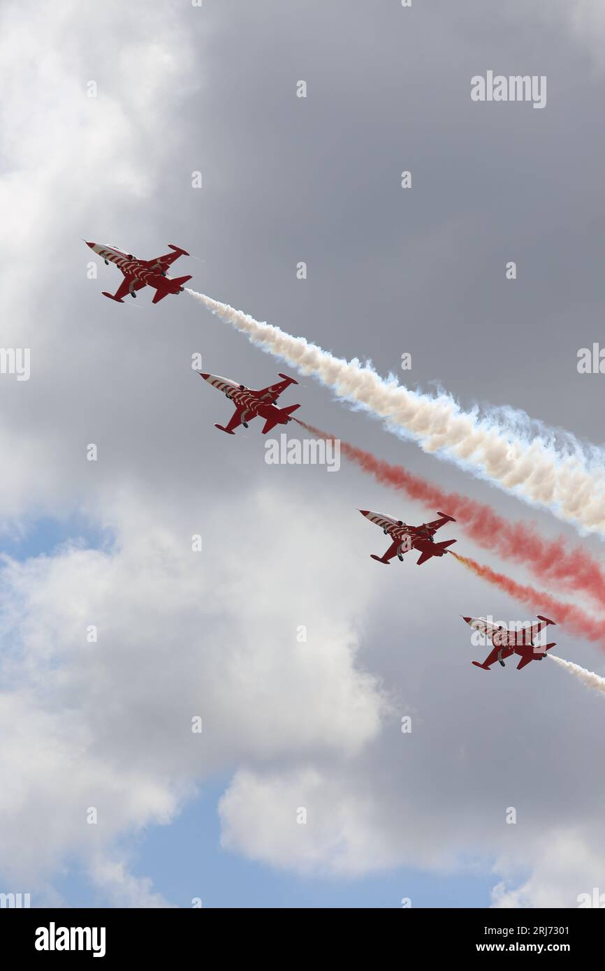 Jet fighters in cloud. Fighter planes in airshow on blue sky. et planes ...