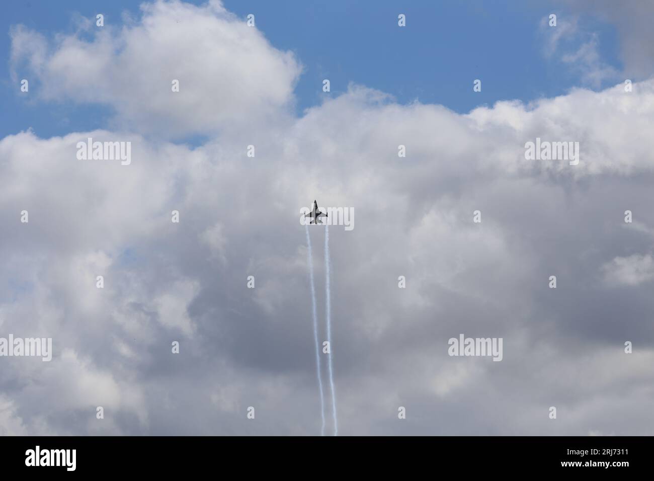 Jet fighters in cloud. Fighter planes in airshow on blue sky. et planes ...