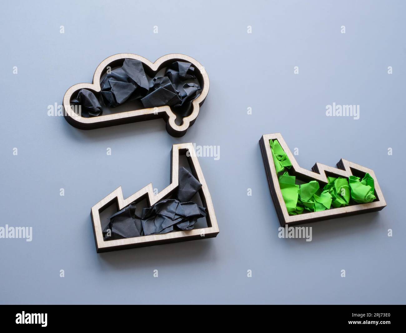 Factory models with black paper balls and green ones as symbol ESG ...