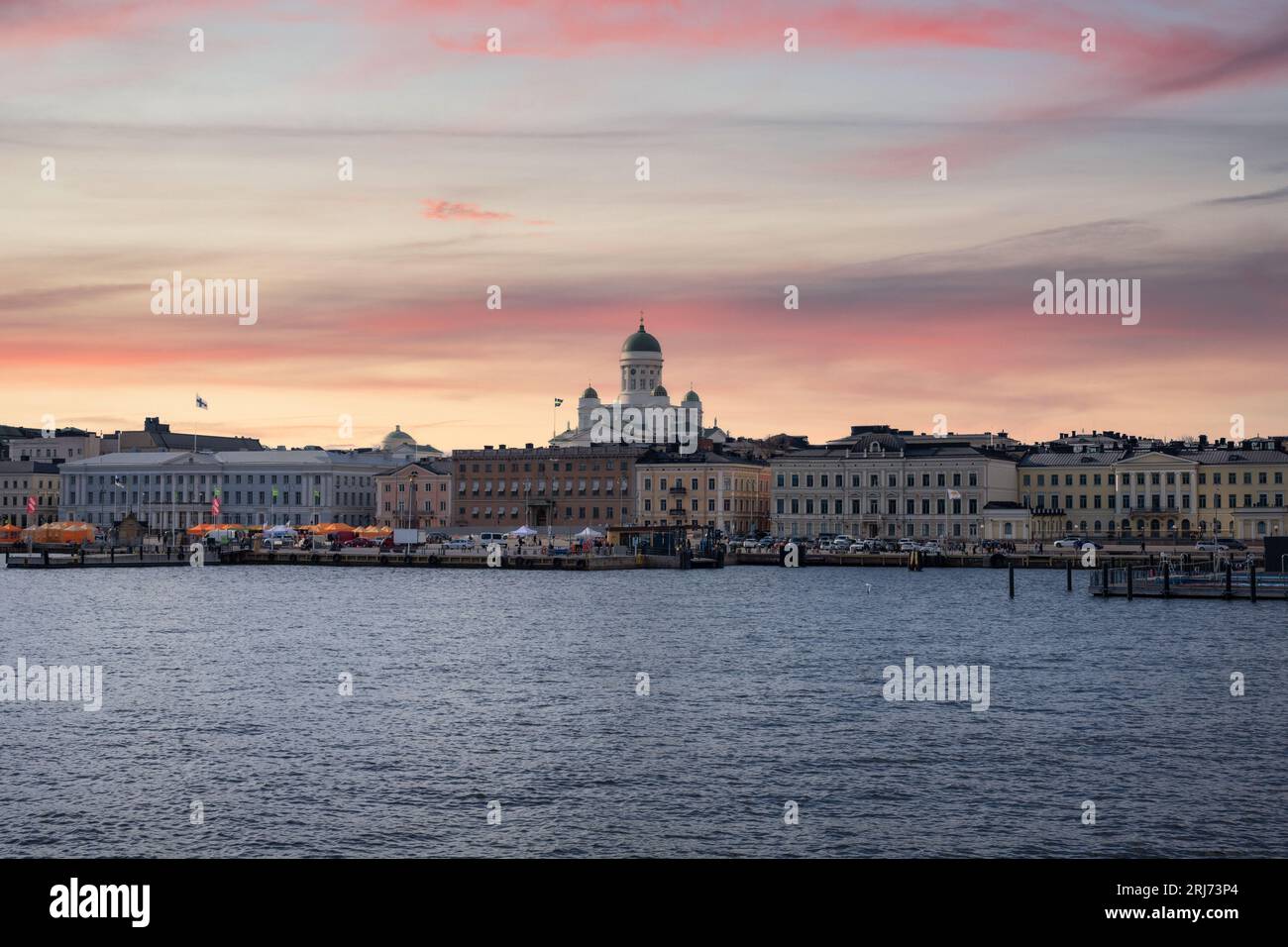A breathtaking view of the Helsinki skyline with a vibrant pink and ...