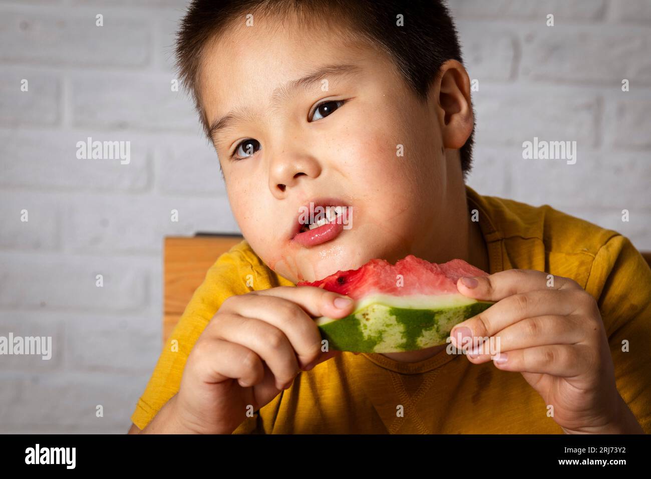 While enjoying the juiciest moments of summer. A boy without teeth ...