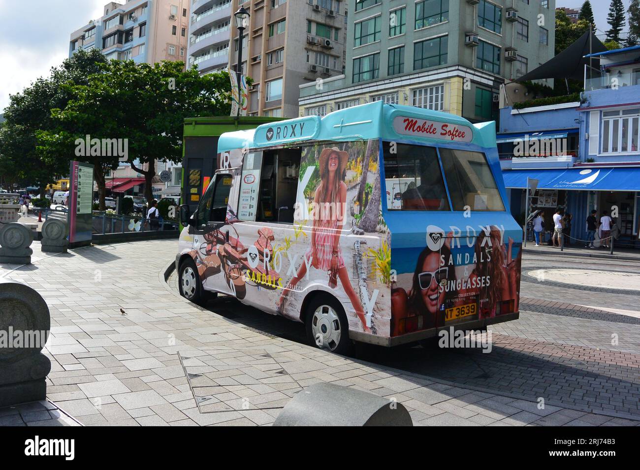 An ice cream car on a busy street in Hong Kong Stock Photo - Alamy