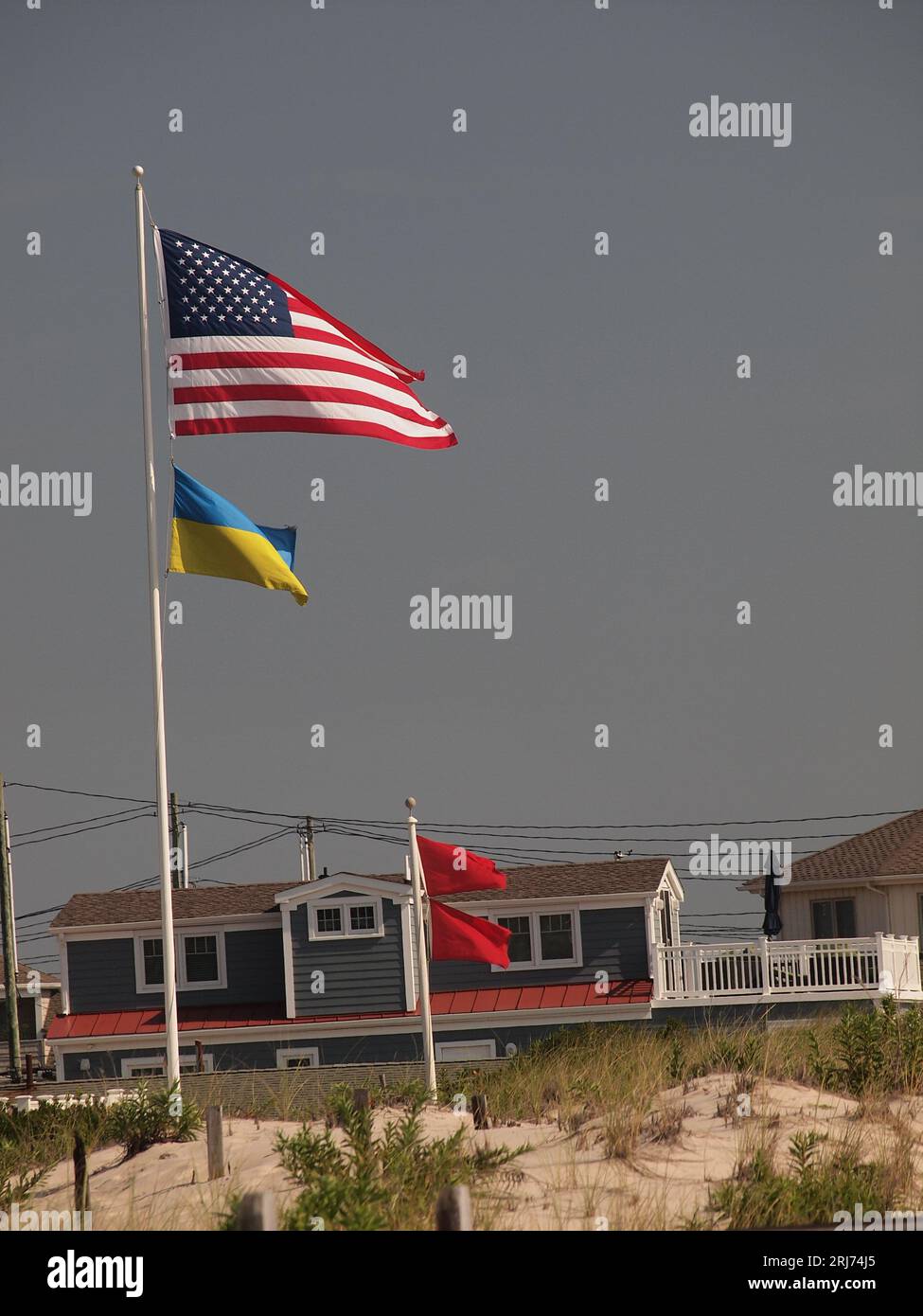 Two flags flying on a single pole hi-res stock photography and images ...