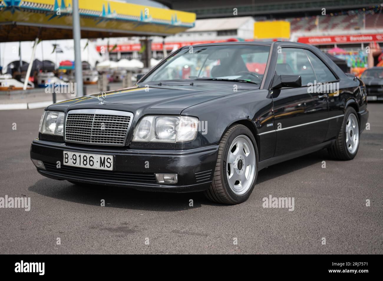 Front view of a luxurious black colored Mercedes Benz C124 Lorinser ...