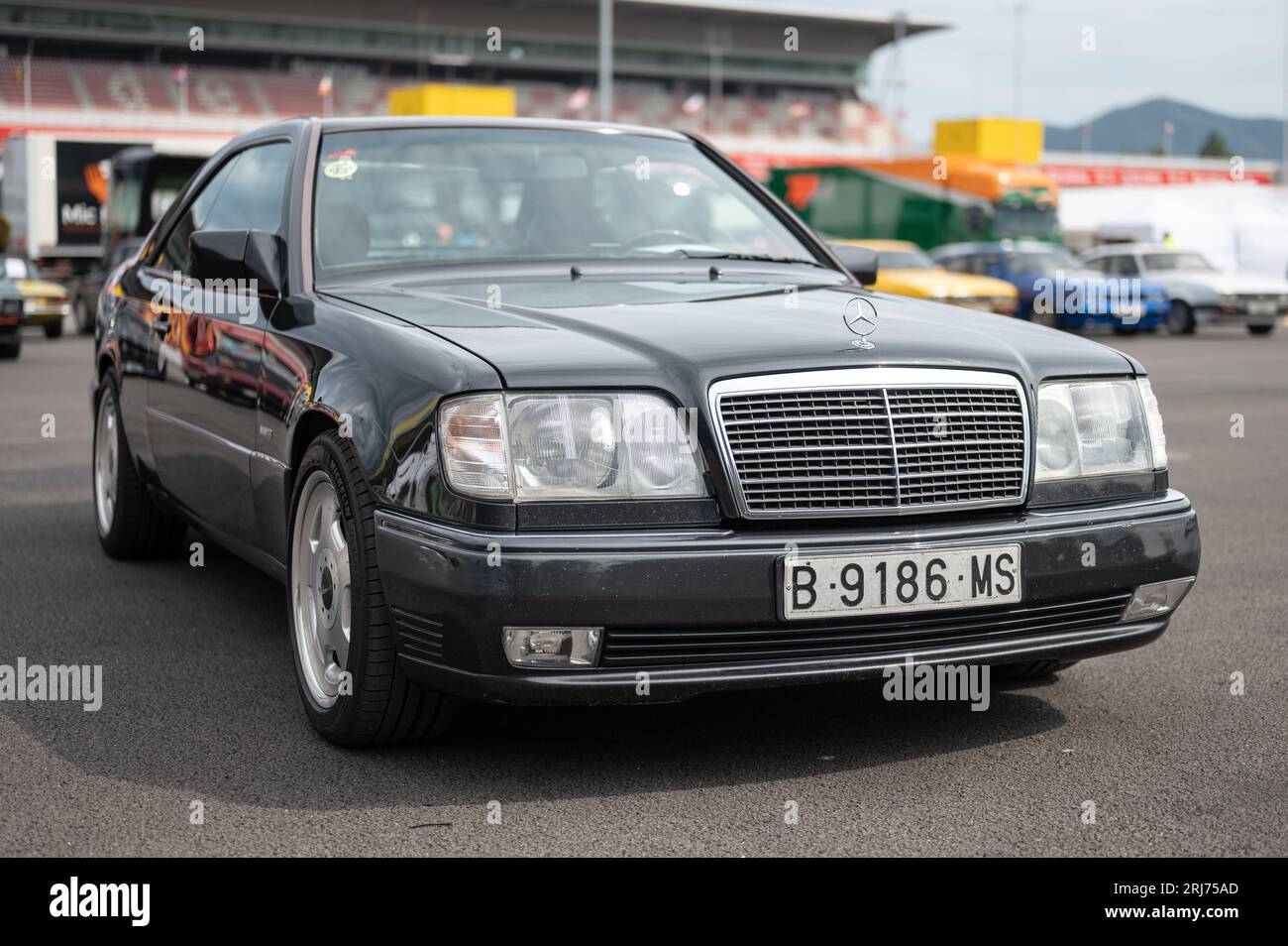 Front view of a luxurious black colored Mercedes Benz C124 Lorinser ...