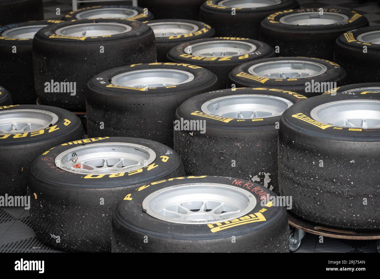 Pile of pirelli p zero single seater racing car wheels Stock Photo - Alamy