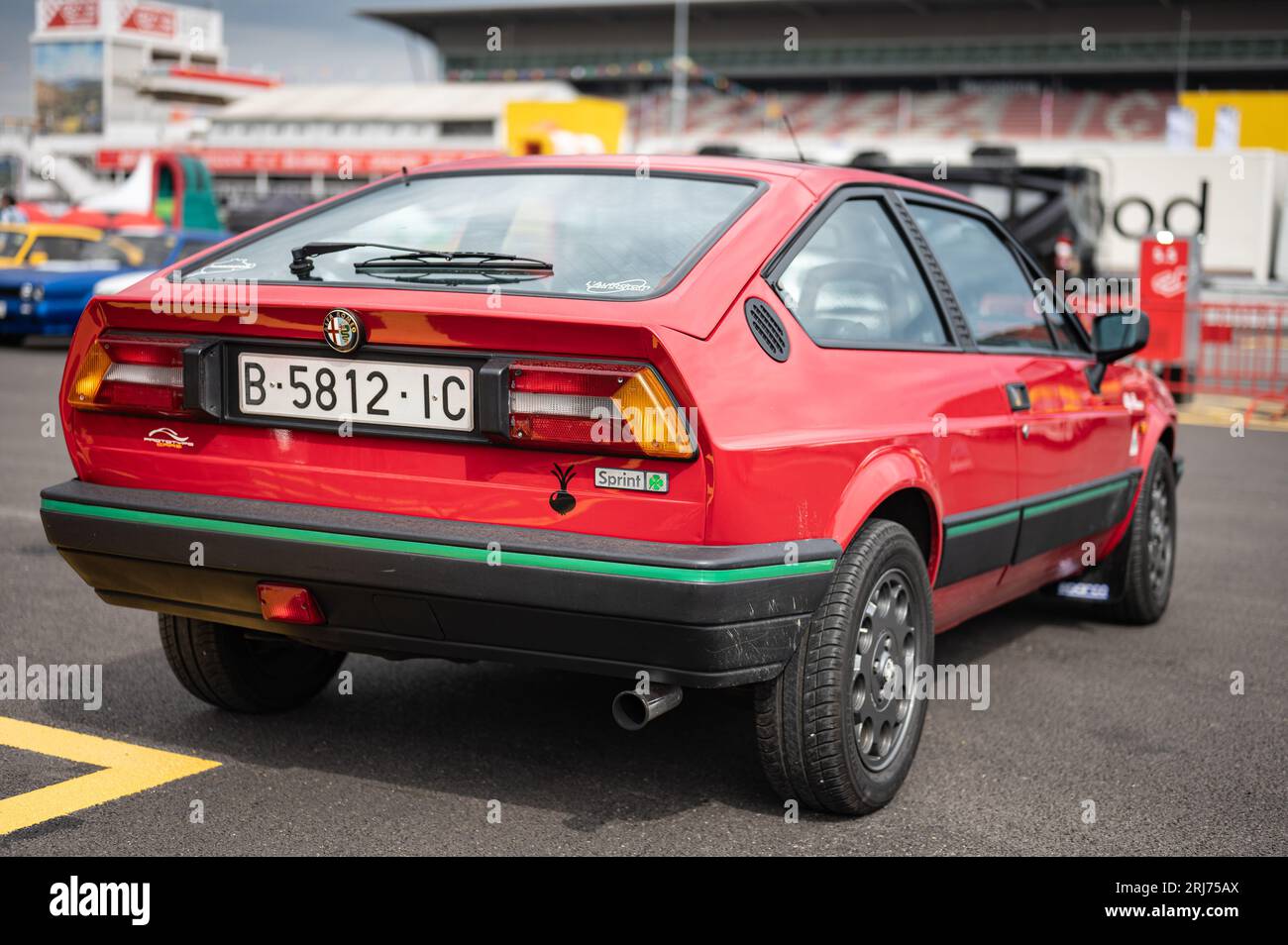 Rear view of the classic Italian sports car Alfa Romeo Sprint in red ...