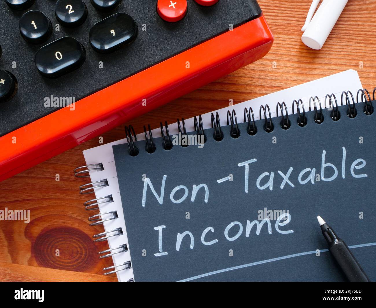 Handwritten inscription non-taxable income on page Stock Photo - Alamy