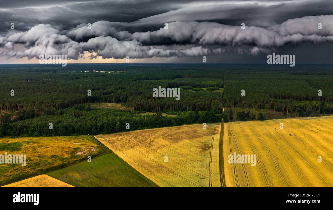 A dramatic view of an incoming storm over a vast expanse of plains ...