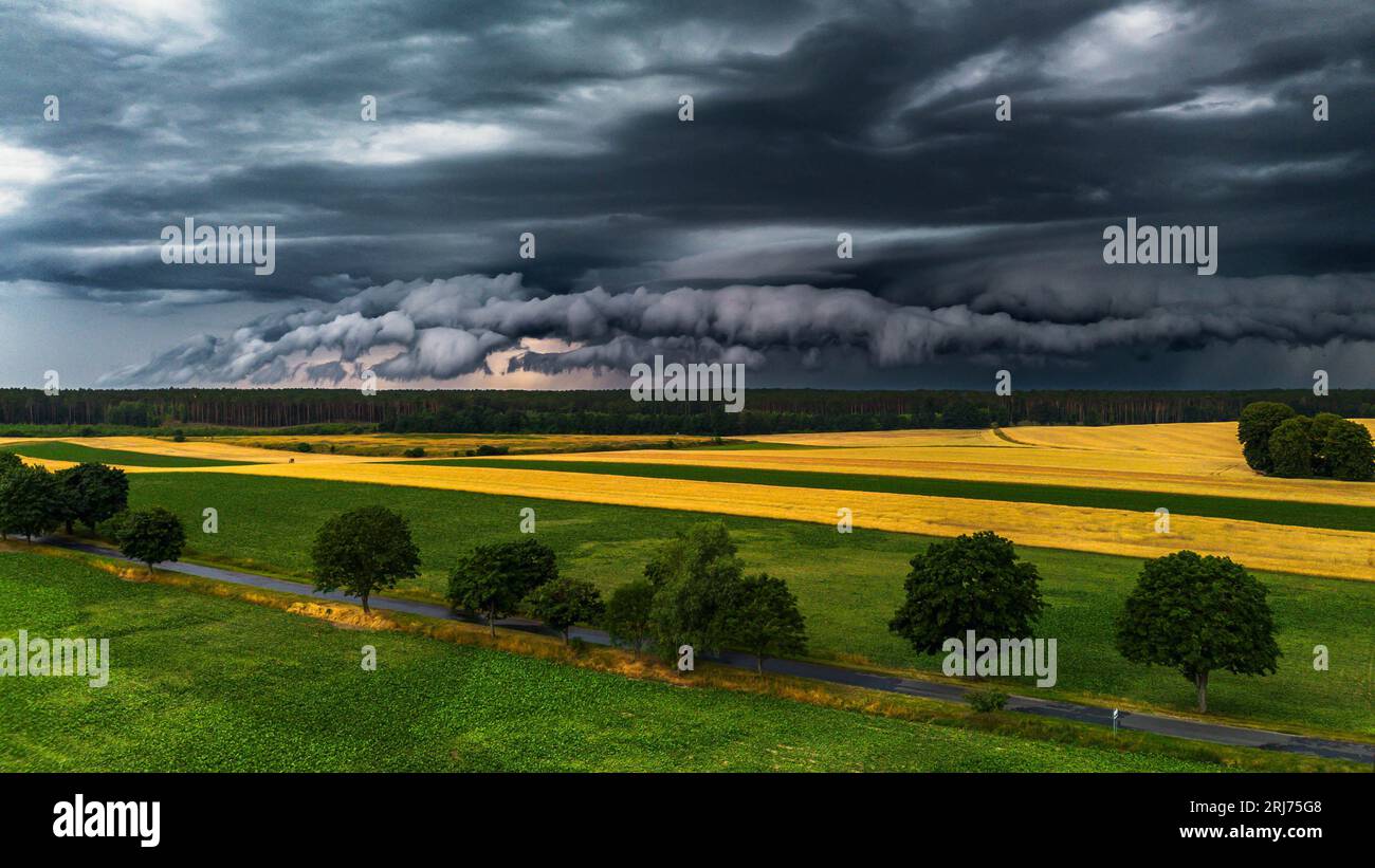 A dramatic view of an incoming storm over a vast expanse of plains ...