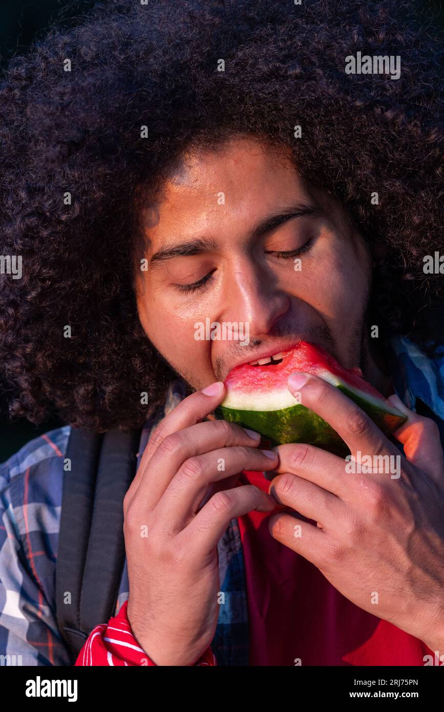 A heartwarming close-up captures the pure joy of a handsome young brown ...