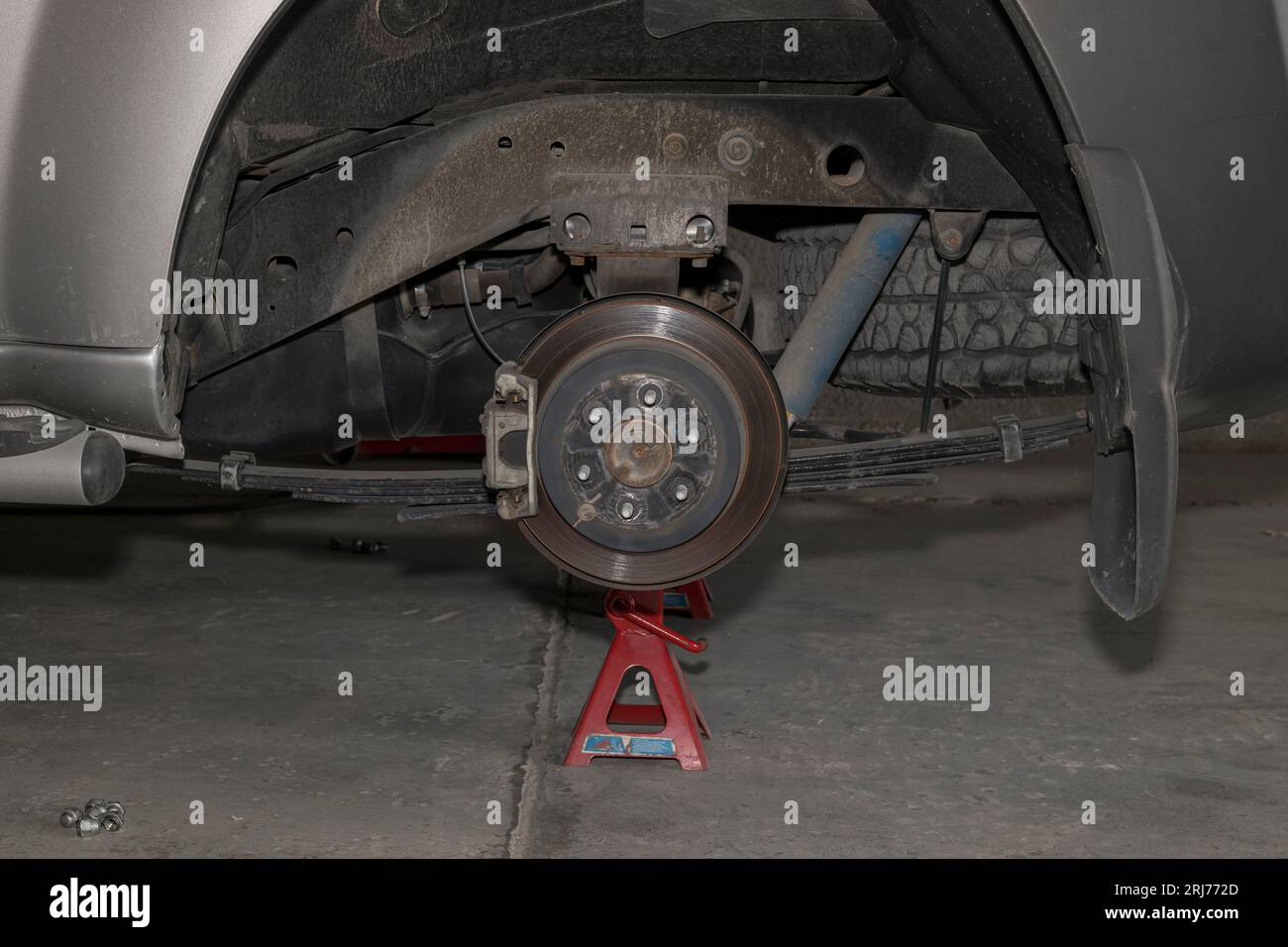 Rear Used brake disc of an all-terrain vehicle in a garage for repair ...
