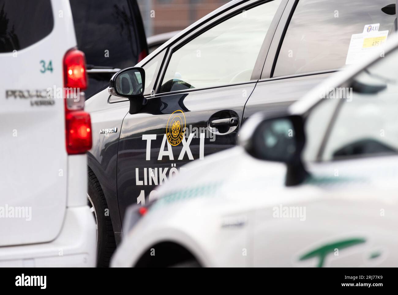 Signs and symbols, taxicabs in a taxi park, Linköping, Sweden Stock ...