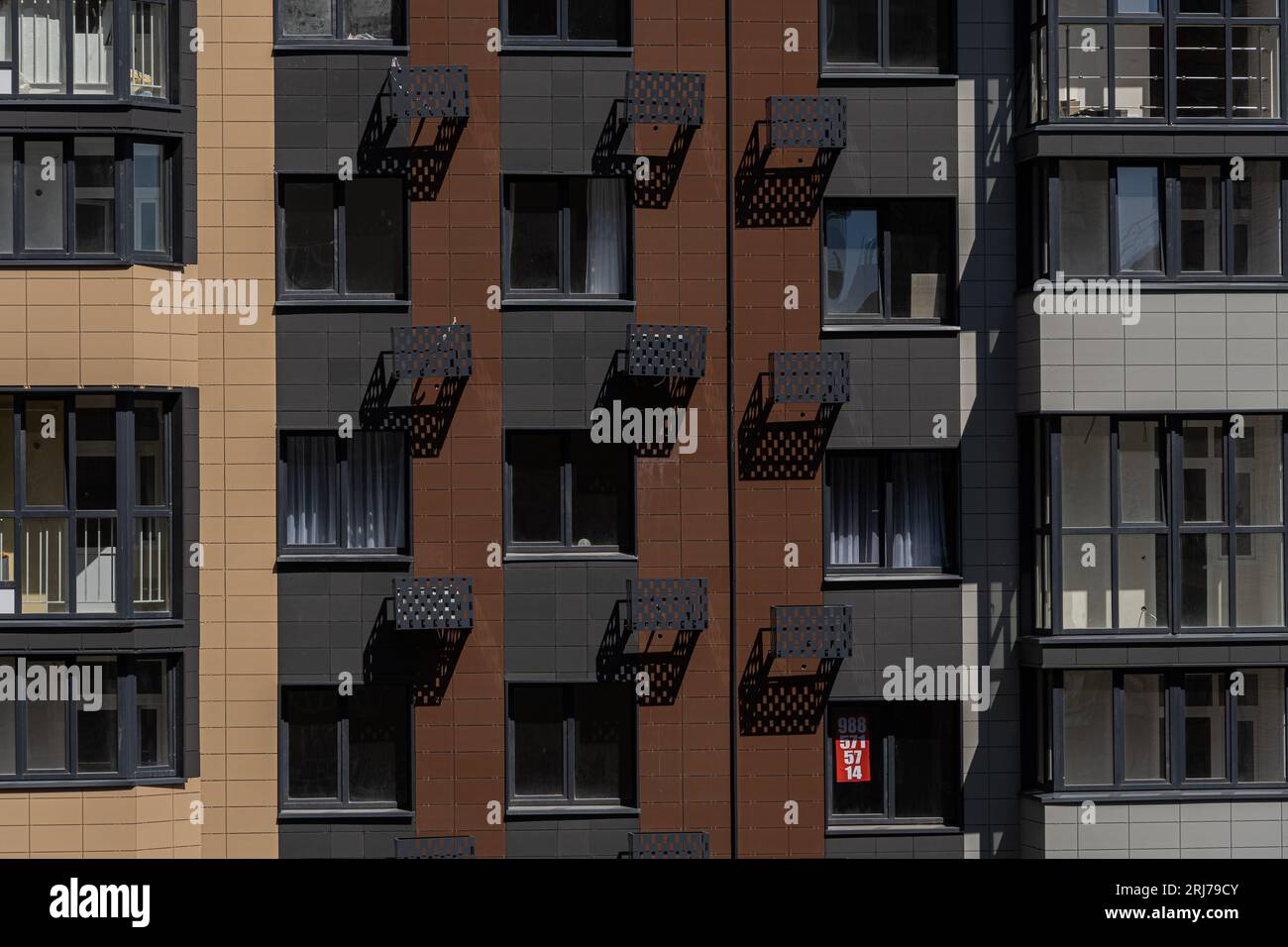 New building facade in housing complex. Modern style in architecture ...