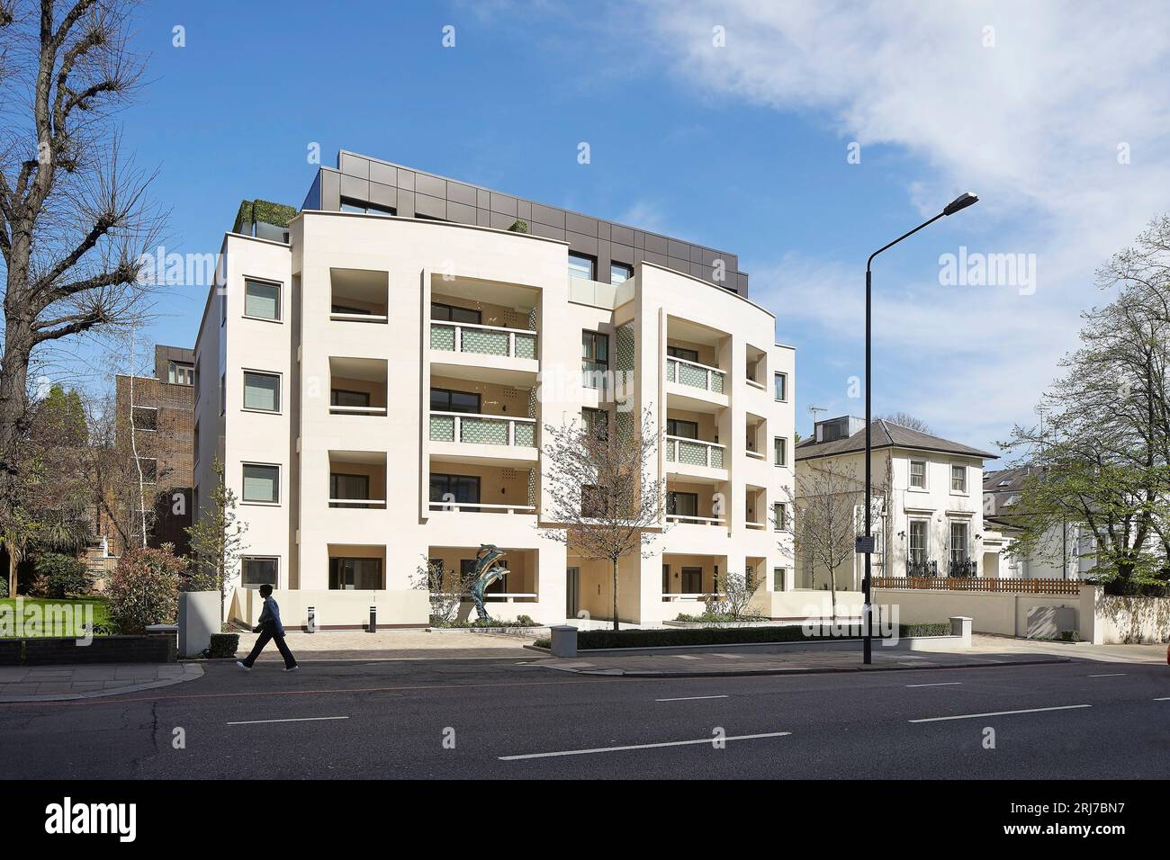 View across street of sunlit building facade. Wellington Road, London ...