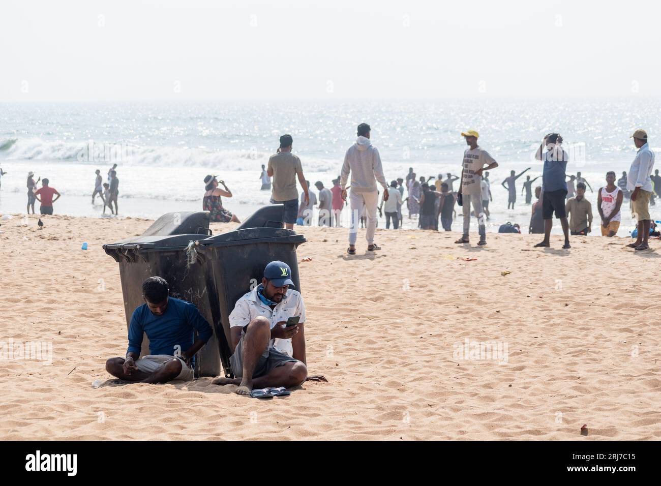 Calangute, Goa, India - January 2023: Two Indian men sitting beside ...