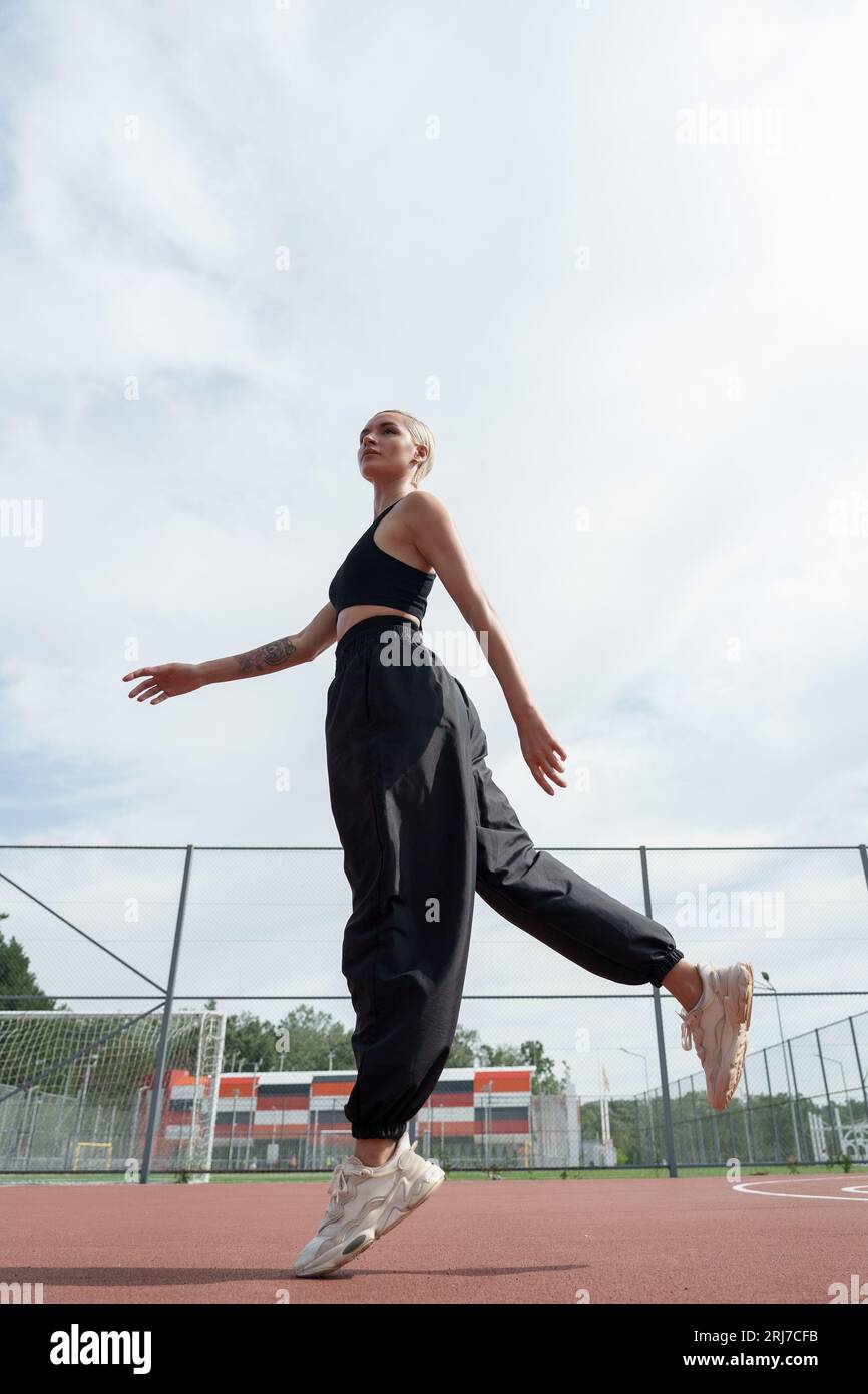 Woman running jumping fence hi-res stock photography and images - Alamy