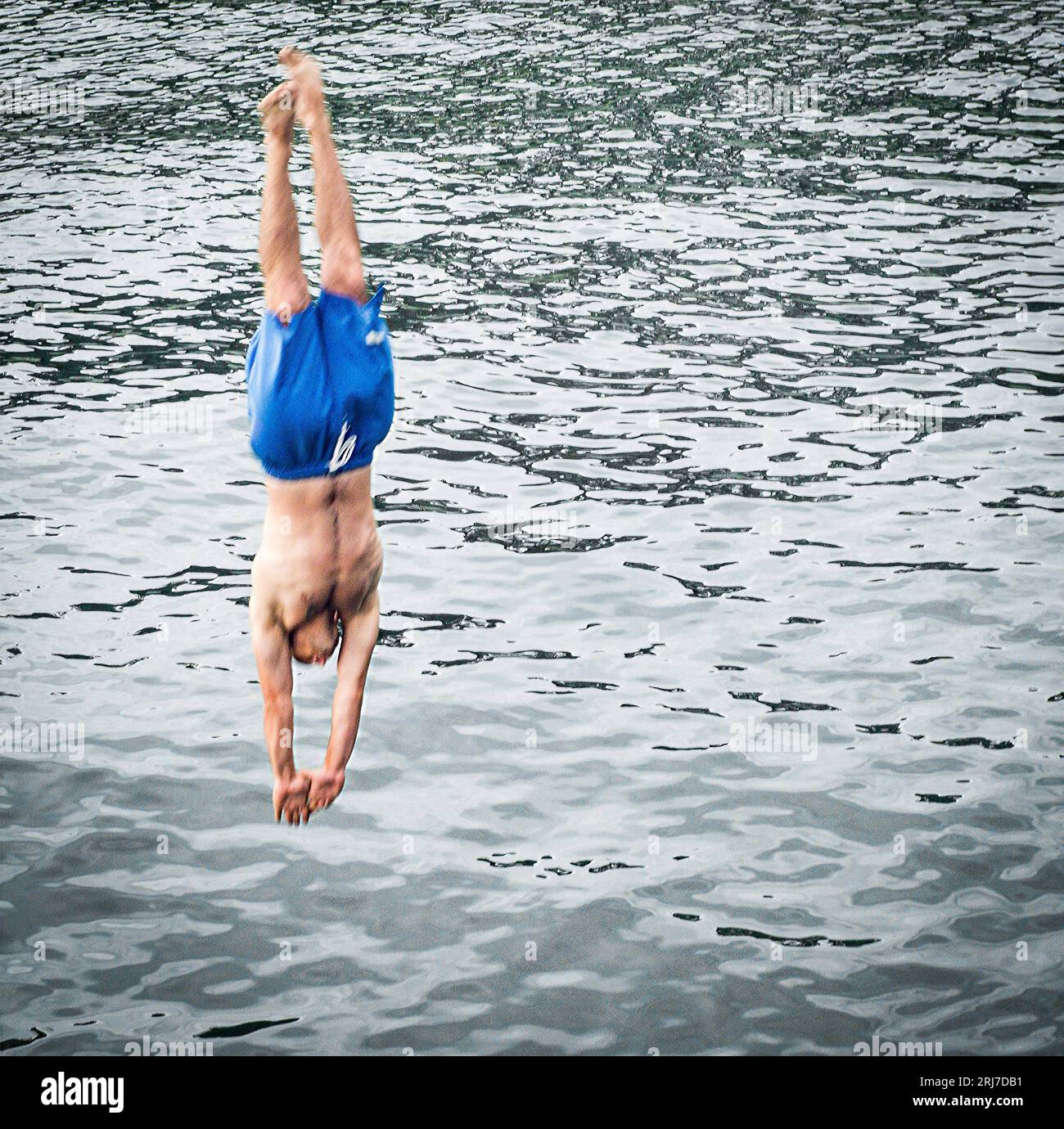 young man have extremal high water jumping Stock Photo - Alamy