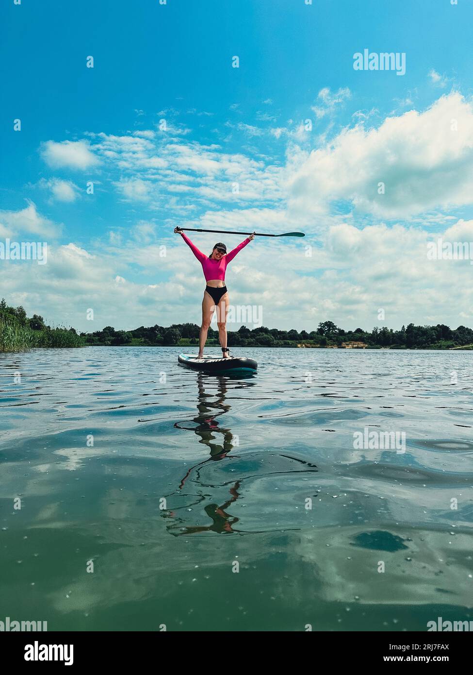beautiful woman standing on supboard keep balance Stock Photo - Alamy
