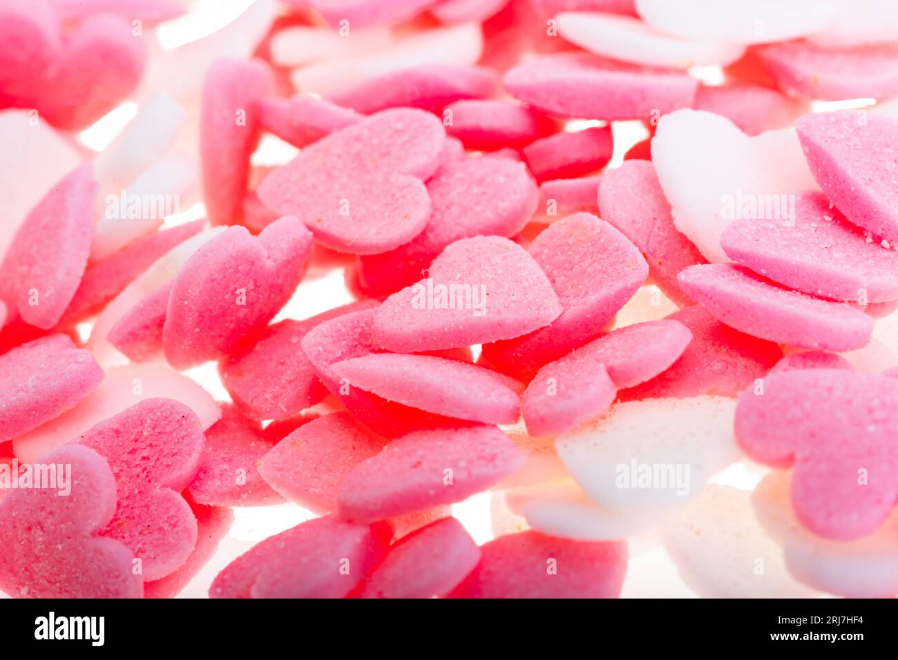 sugar small hearts isolated on white background Stock Photo - Alamy