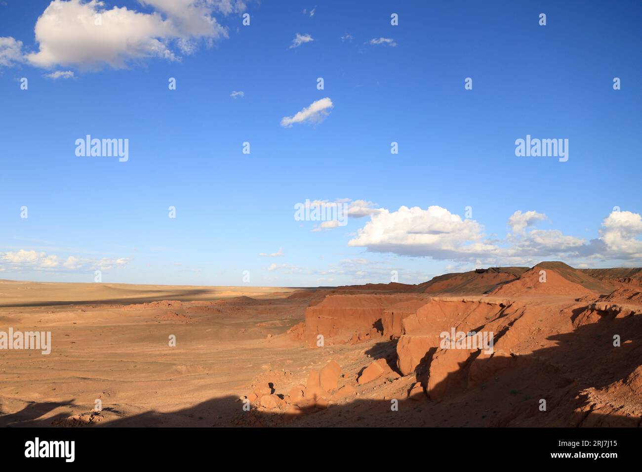 The rock formations of Bayanzag flaming cliff at sunset, Mongolia Stock ...