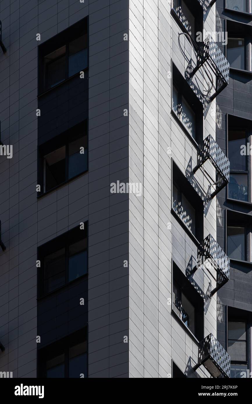 New building facade in housing complex. Modern style in architecture ...
