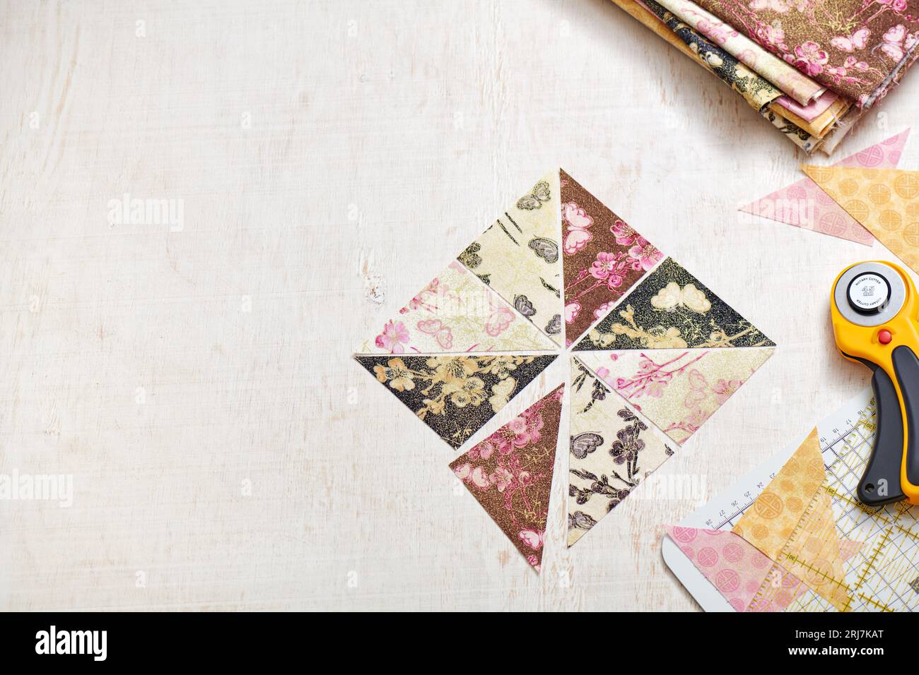 Preparing of triangle pieces of fabrics for sewing quilt block, rotary ...