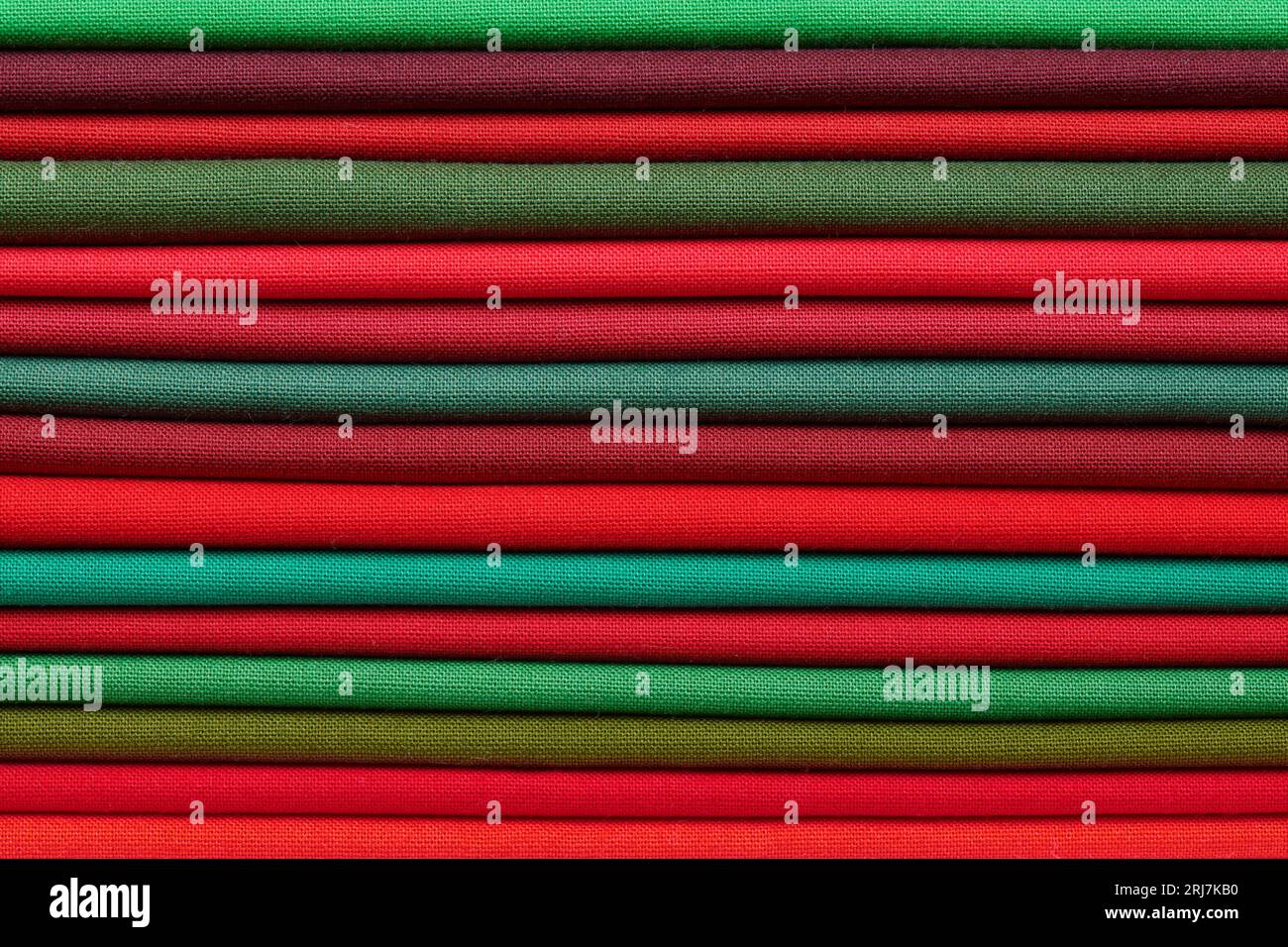 Stack of red and green fabrics as a vibrant background image Stock ...