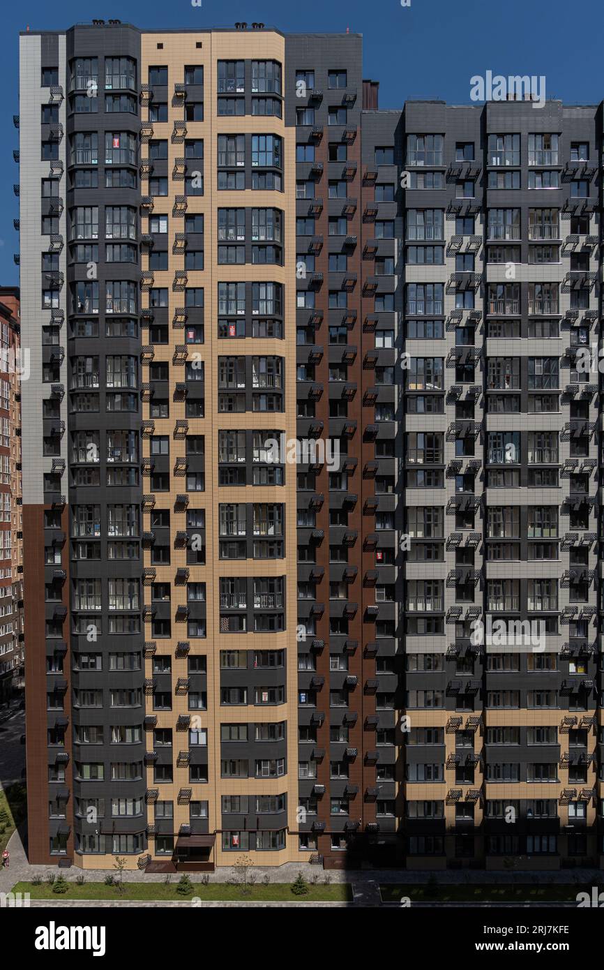 New building facade in housing complex. Modern style in architecture ...