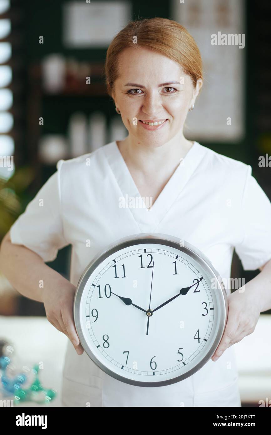 Healthcare time. happy massage therapist woman in massage cabinet with ...