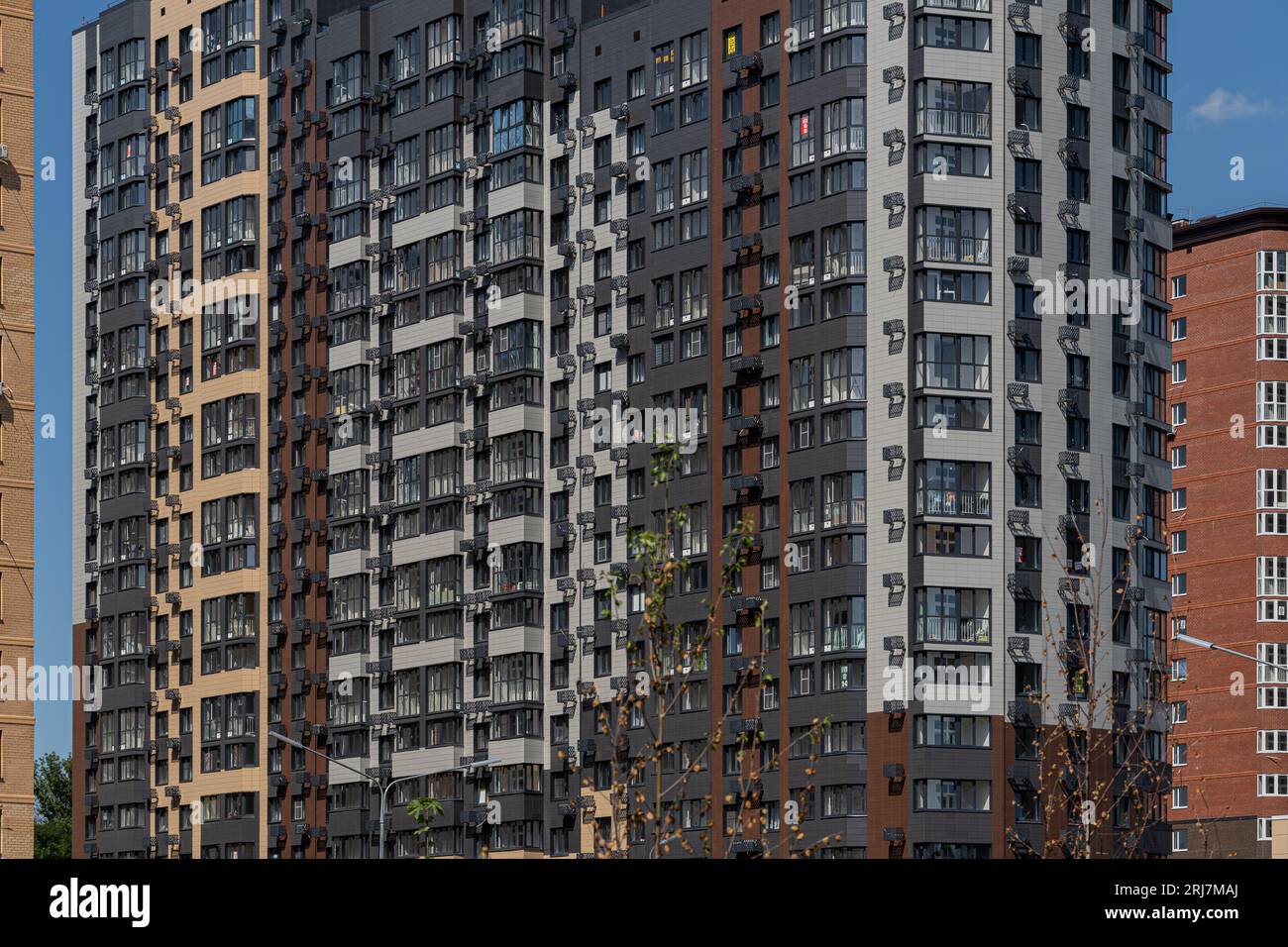 New building facade in housing complex. Modern style in architecture ...