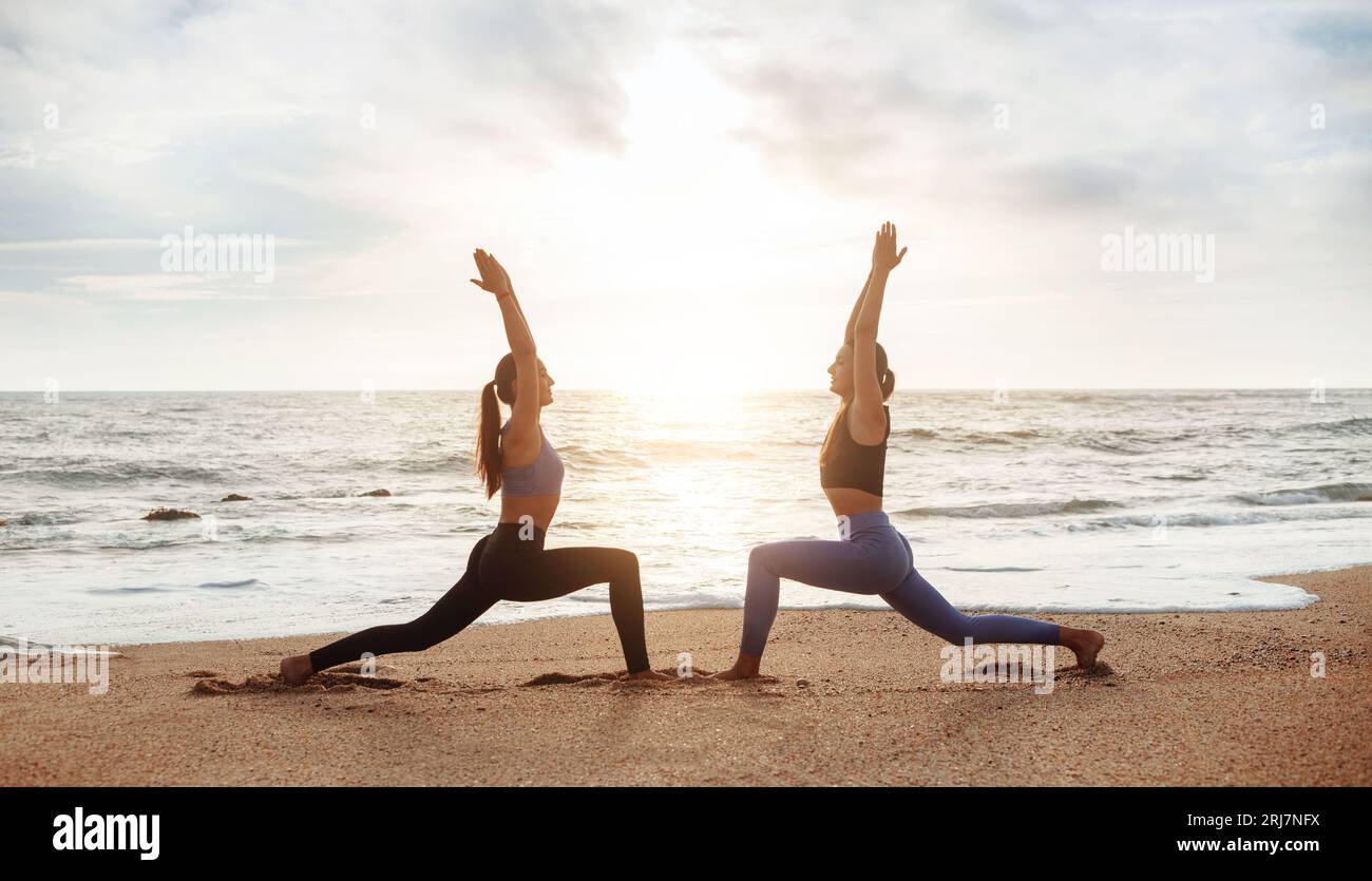 Calm cheerful young caucasian women enjoy morning workout, breathing ...